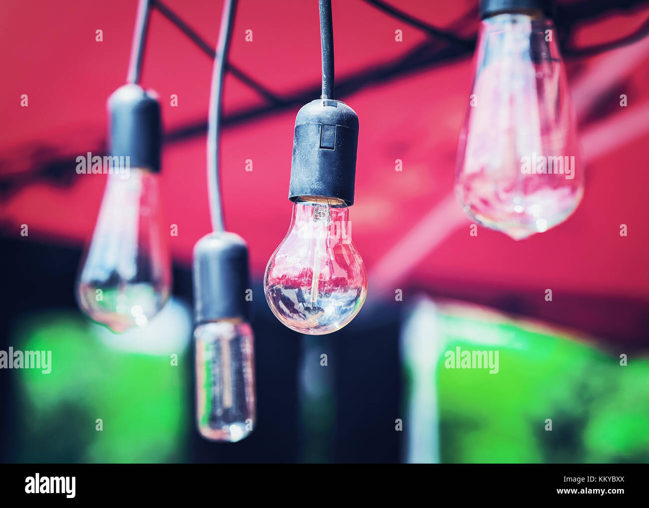 Light bulbs hanging in the street cafe Stock Photo - Alamy