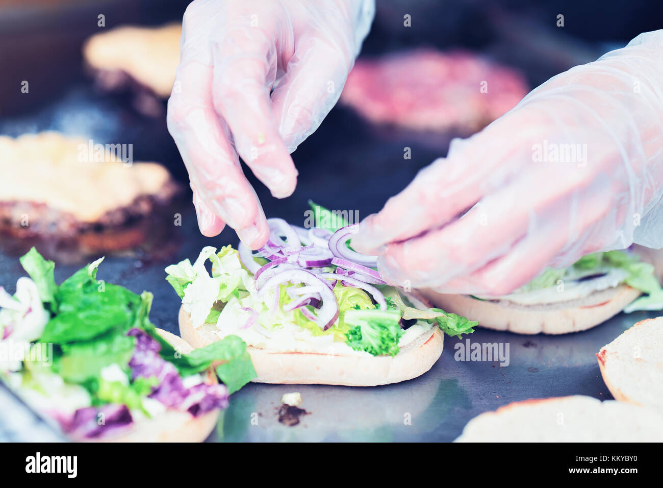 Preparation of burgers at Open Kitchen food festival in Vilnius ...