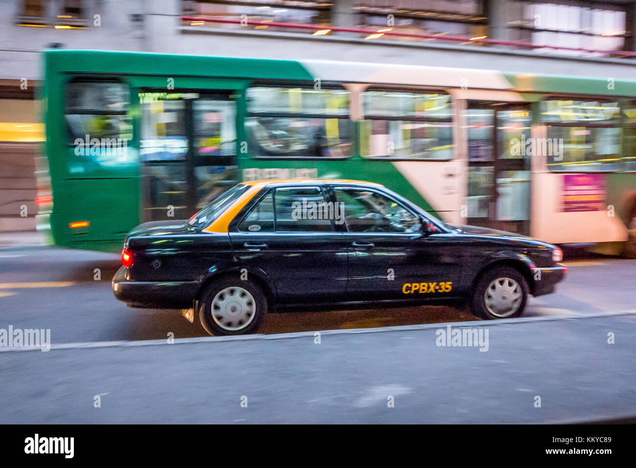 A taxi and a bus in central Santiago, Chile Stock Photo - Alamy