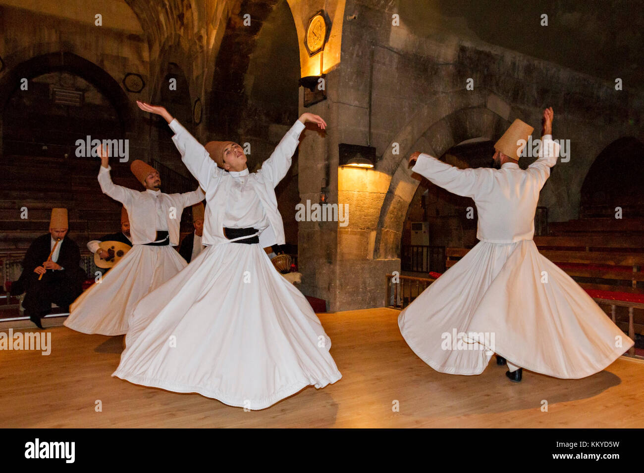 Whirling dervishes performing in an old caravansary in Nevsehir, Turkey ...