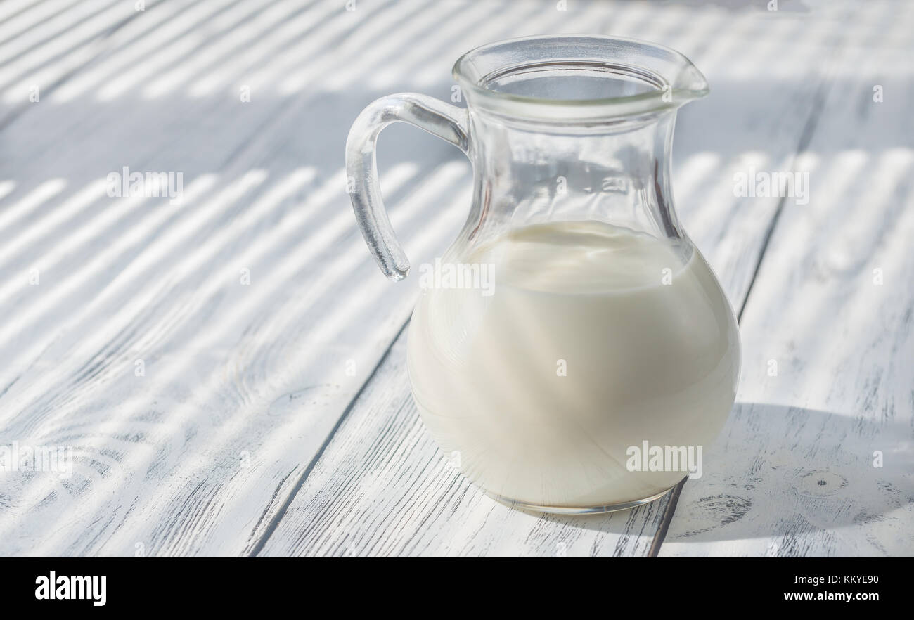 Glass pitcher of milk Stock Photo - Alamy