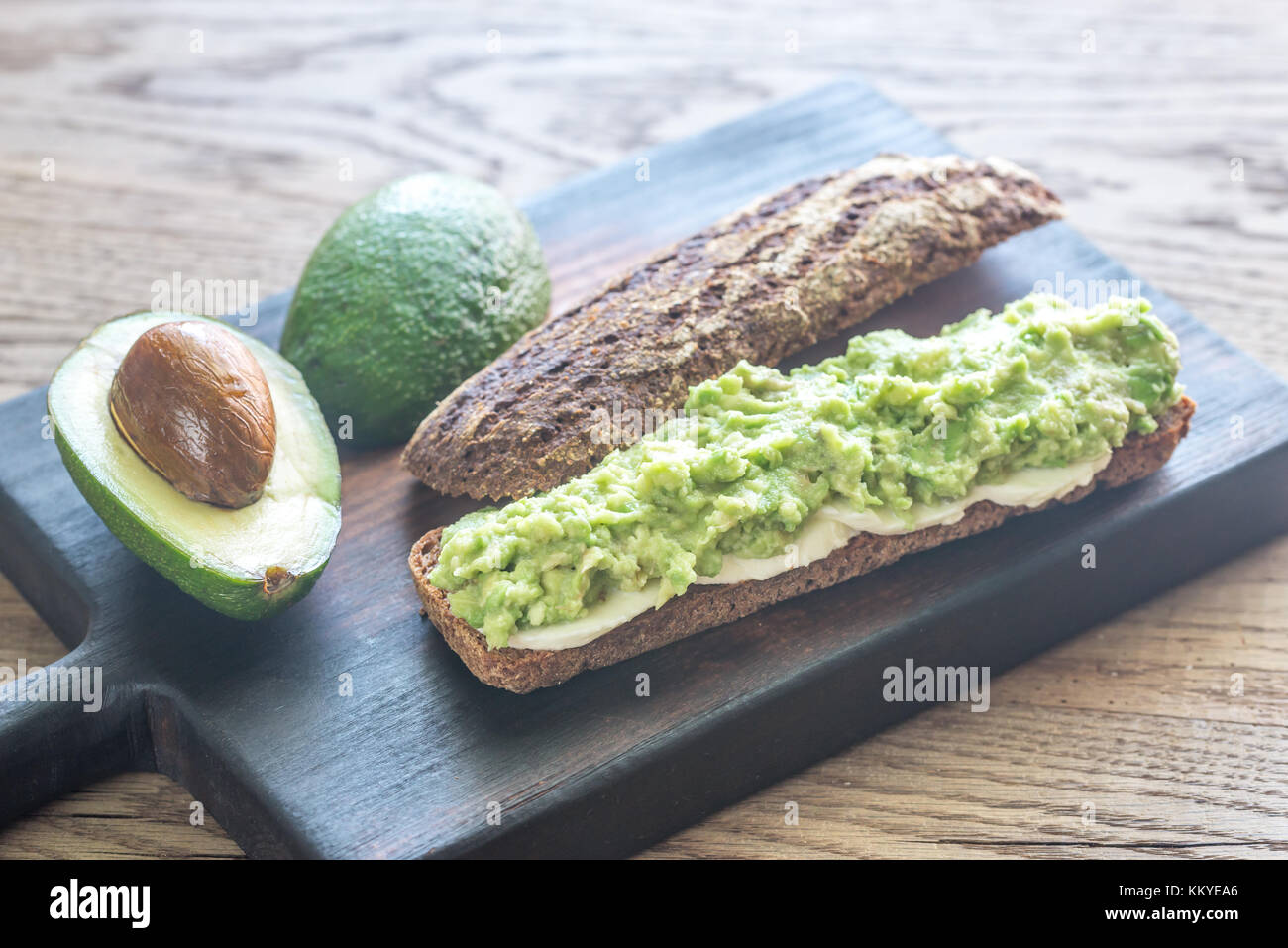 Sandwich with smashed avocado Stock Photo - Alamy