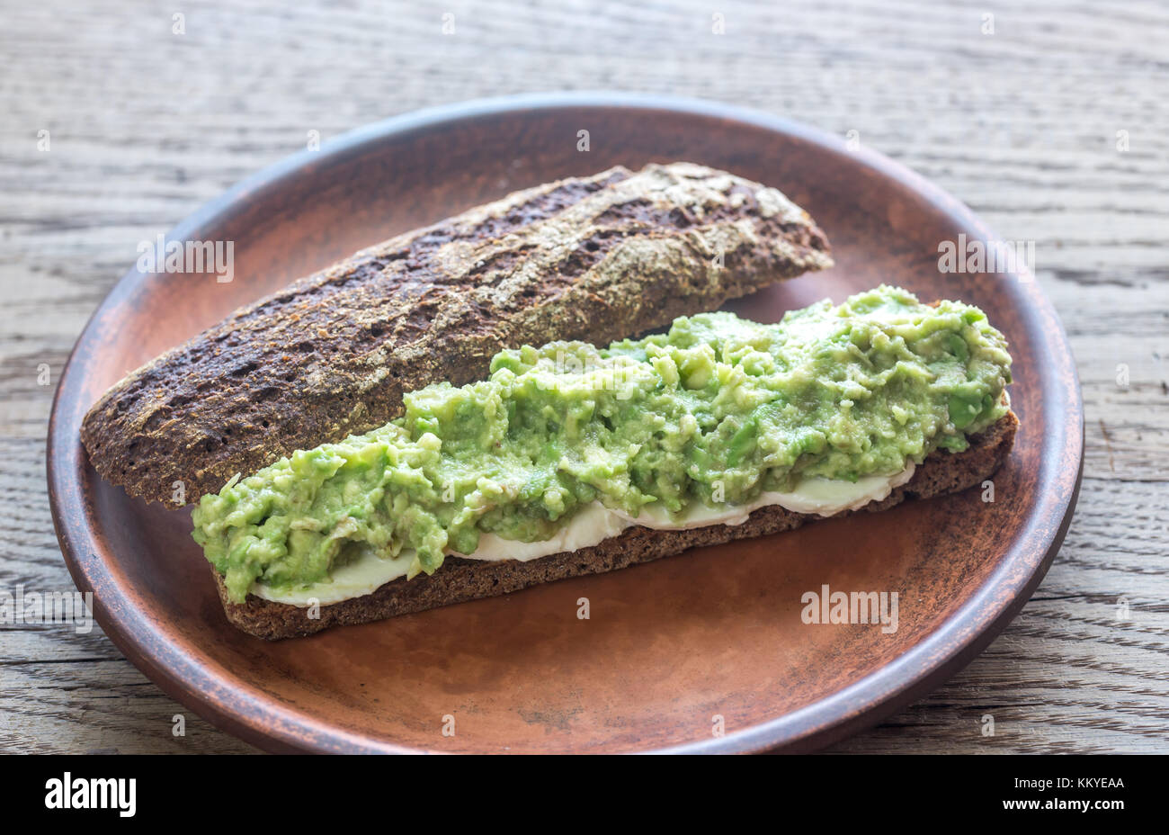 Sandwich with smashed avocado Stock Photo - Alamy