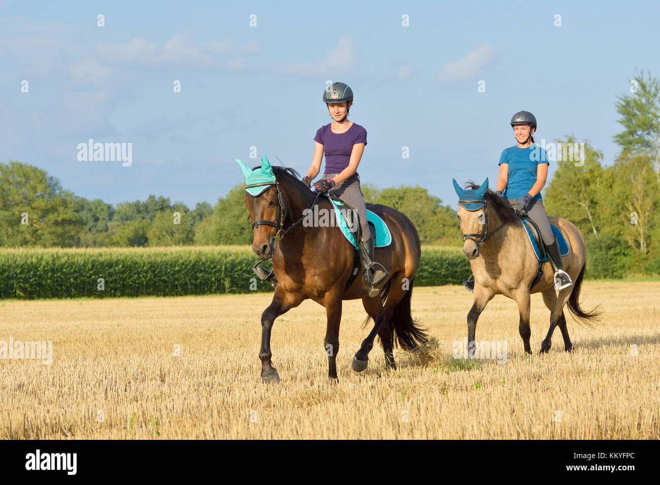 Two girls on ponies riding hi-res stock photography and images - Alamy