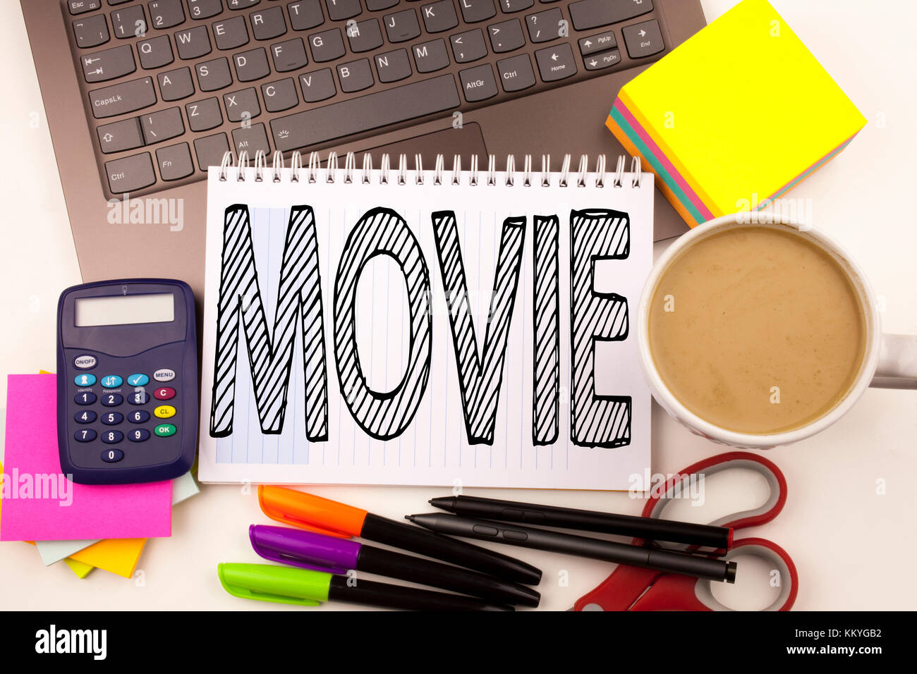 Word writing Movie in the office with laptop, marker, pen, stationery ...