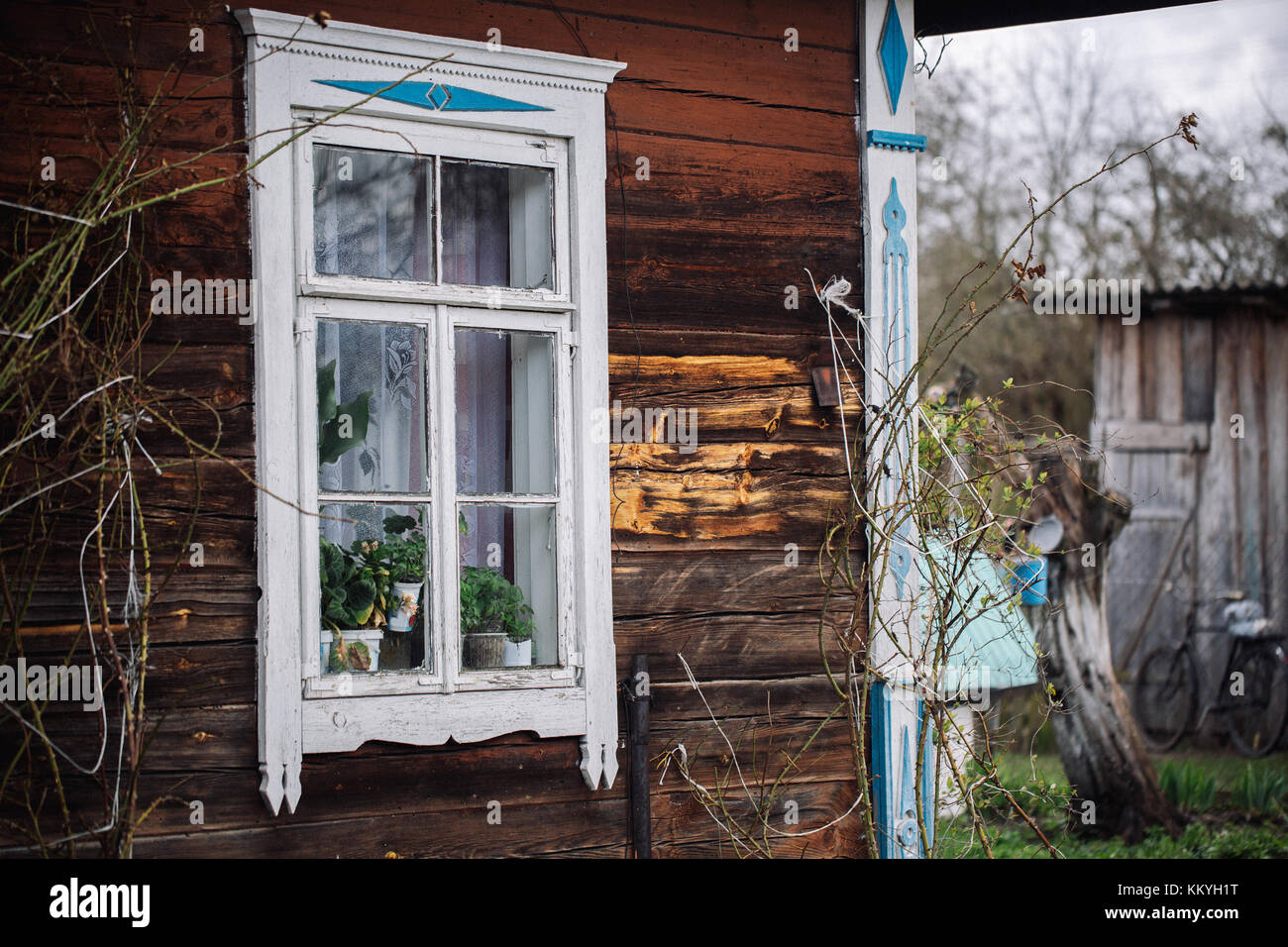 Window of old wooden house in village. Countryside background ...