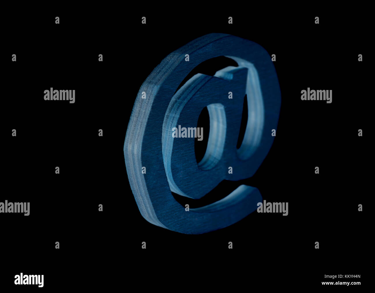 Blue email sign on a black background Stock Photo - Alamy