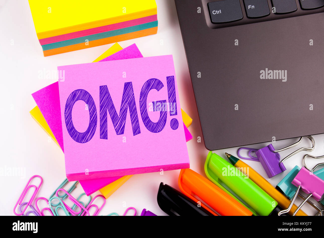 Writing text showing OMG Oh My God made in the office with surroundings ...