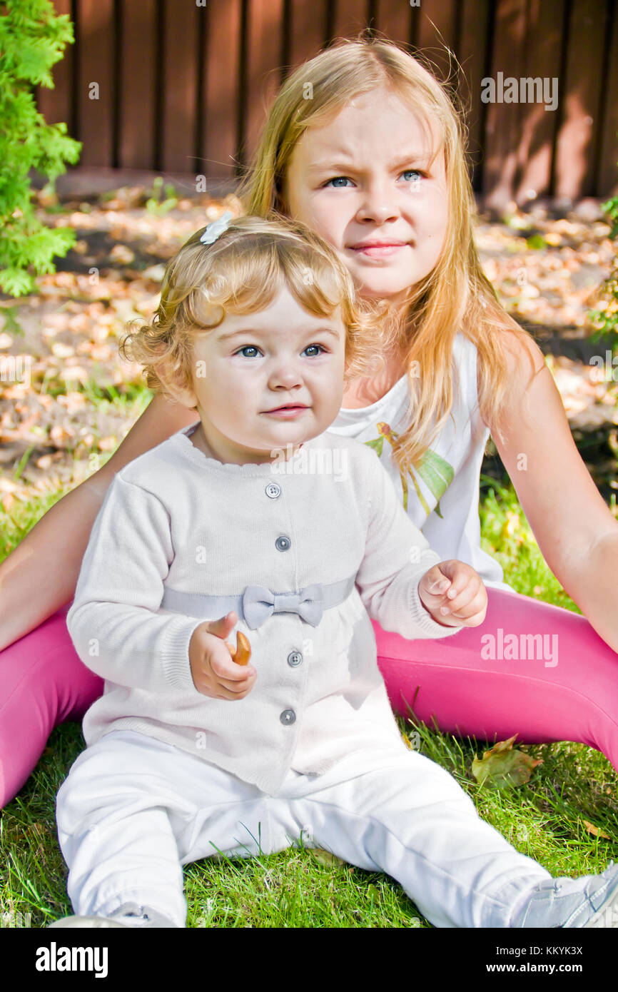 Photo of two playing girls in summer Stock Photo - Alamy