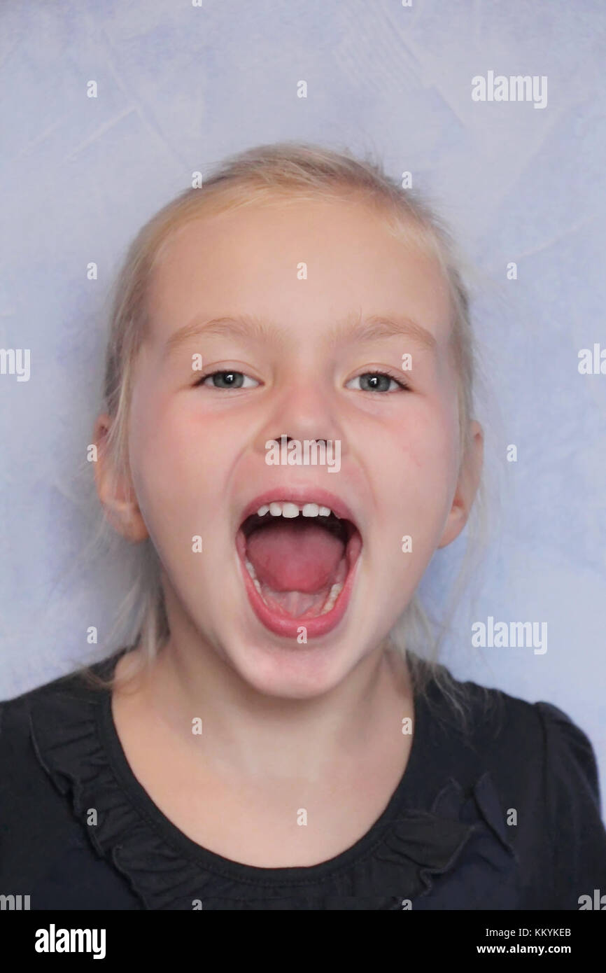 Portrait of girl with smile and open mouth Stock Photo - Alamy