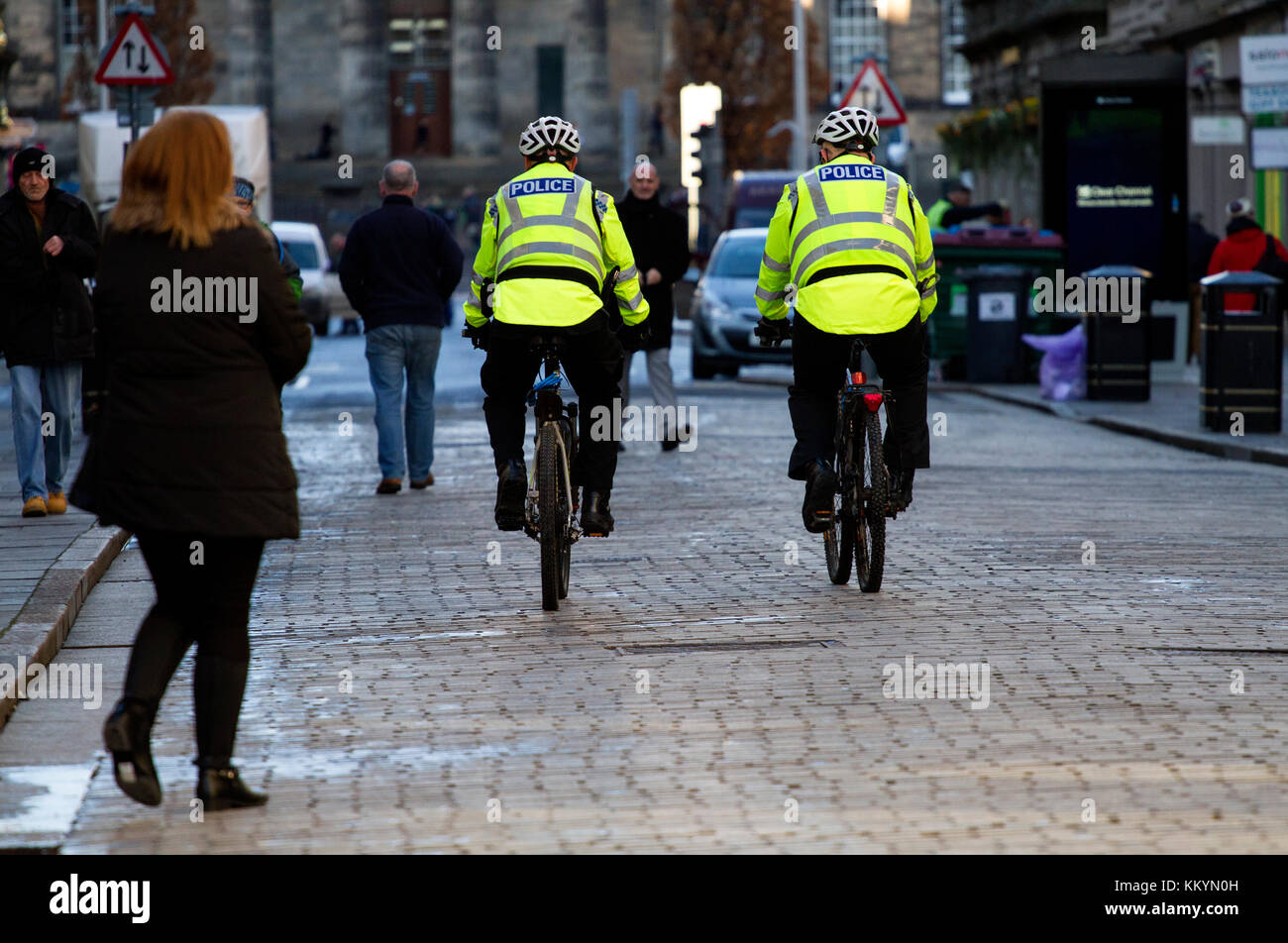 Two Police Scotland cyclists on patrol riding their bicycles along ...