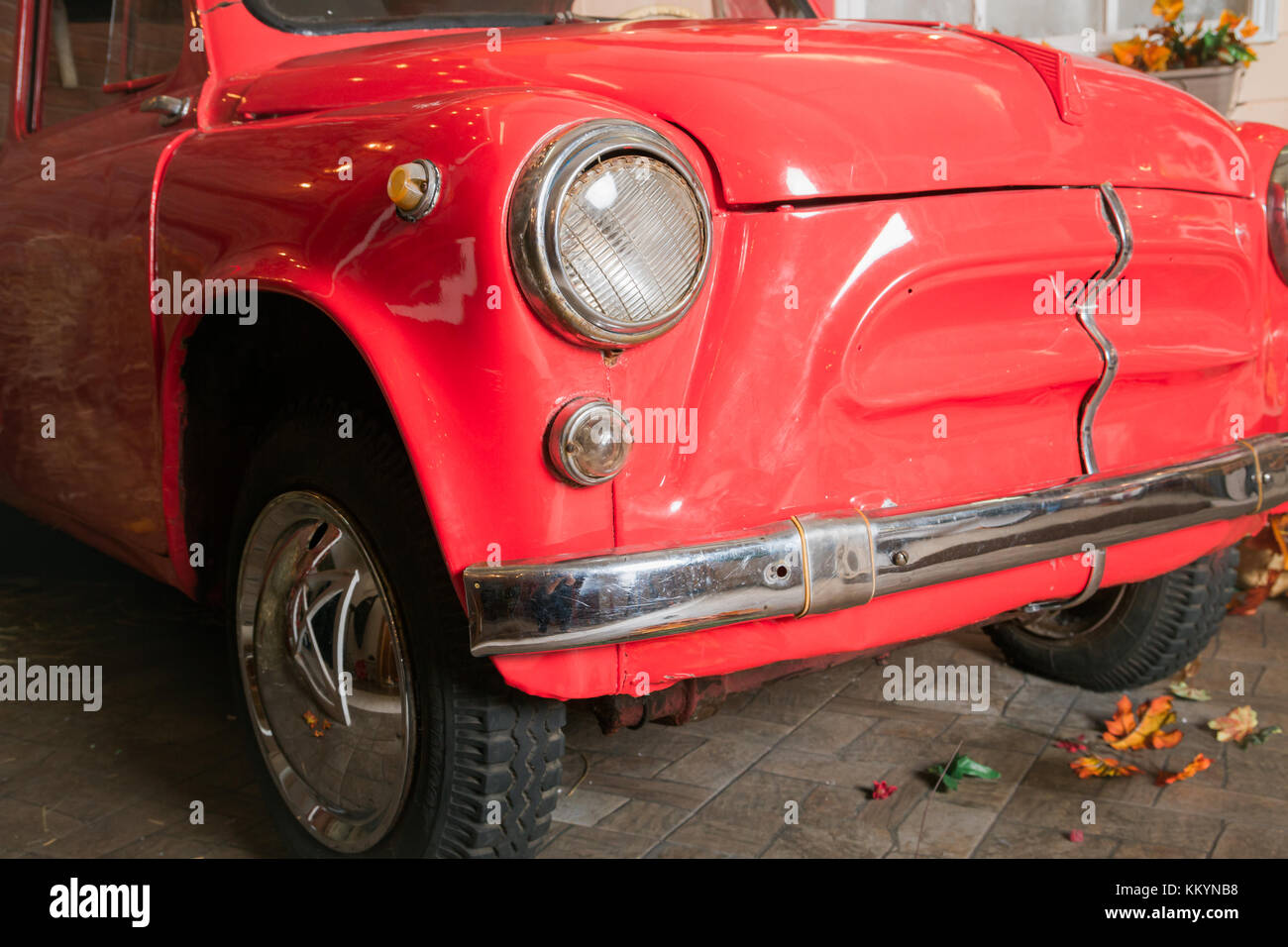 Retro red car on autumn scenery in front of the house Stock Photo - Alamy
