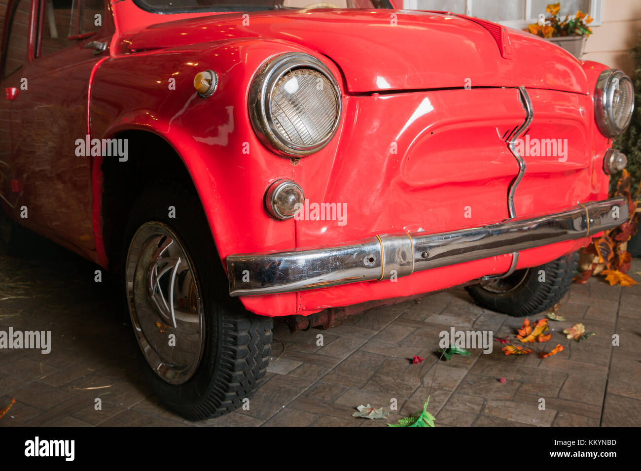 Retro red car on autumn scenery in front of the house Stock Photo - Alamy