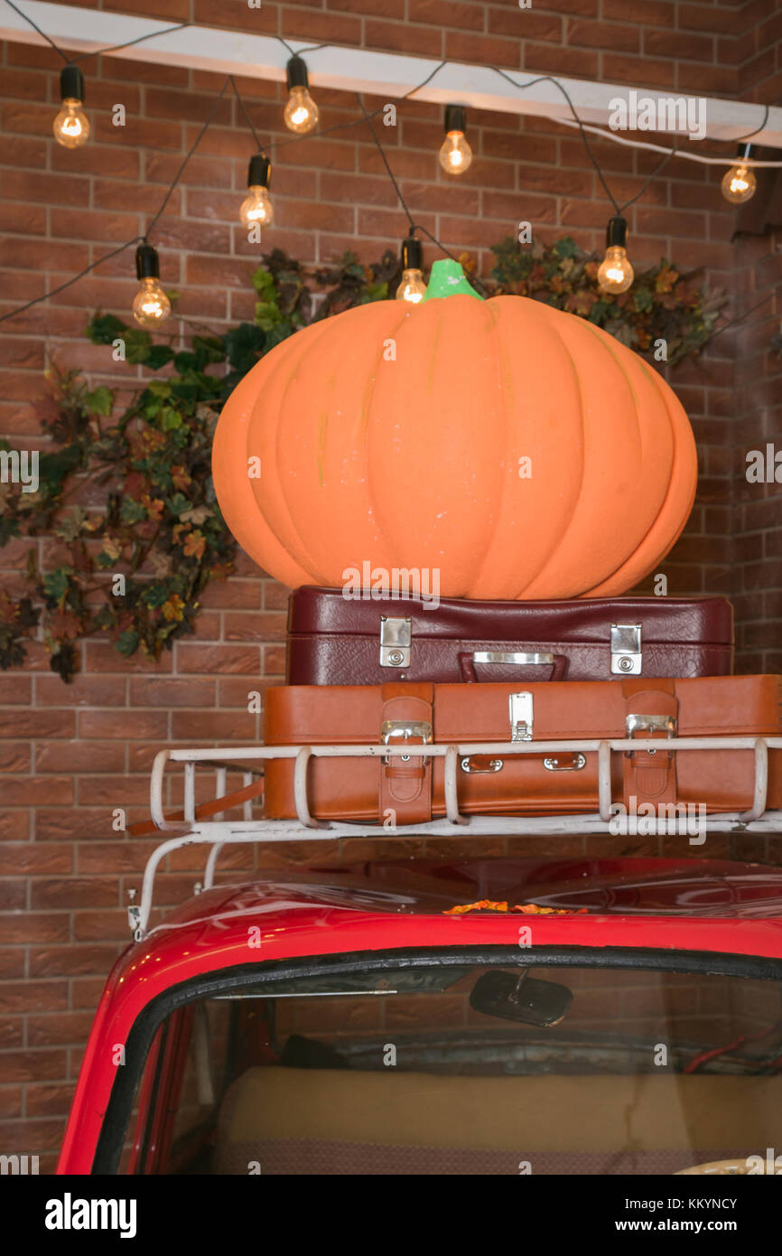 Retro red car on autumn scenery in front of the house Stock Photo - Alamy