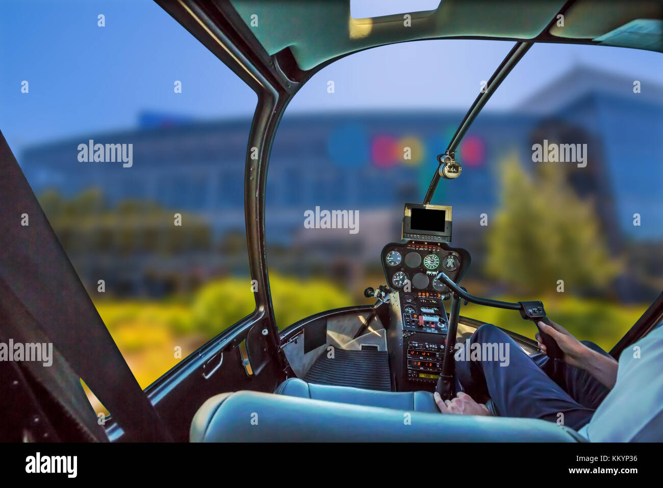 Helicopter cockpit with pilot arm and control console inside the cabin ...