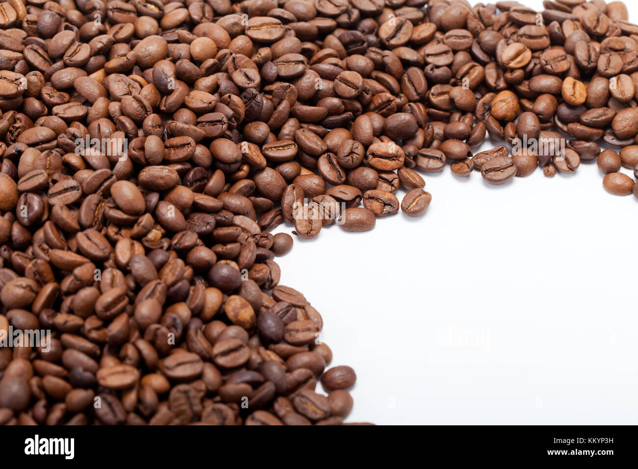 coffee beans close up isolated on white Stock Photo - Alamy