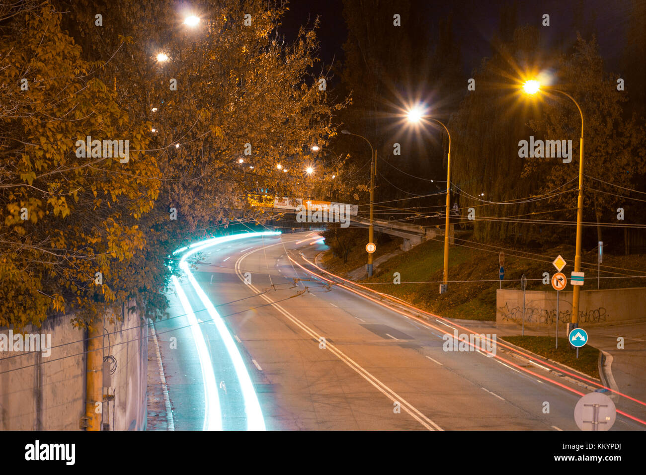 night road long exposure on the highway with light trails from the ...