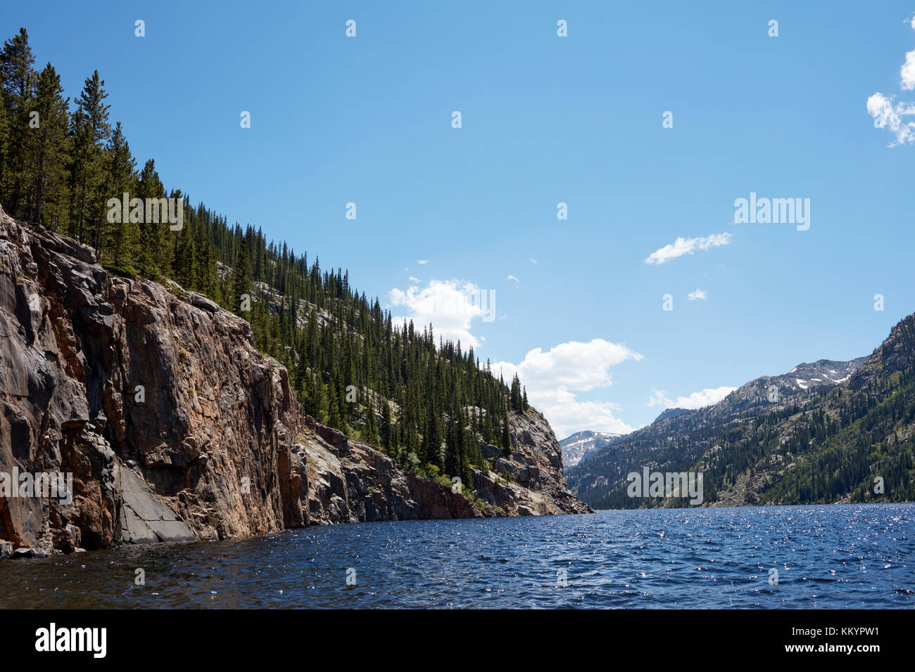 Landscape of coniferous forest with rocky cliffs by mountain lake Stock ...