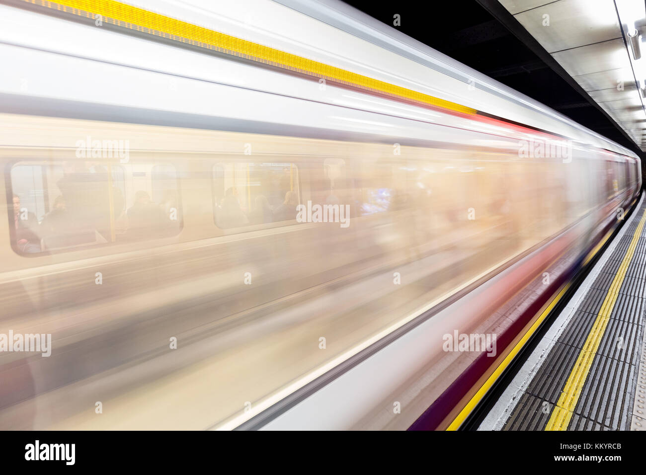 Motion blurred moving train on London Underground tube station Stock ...