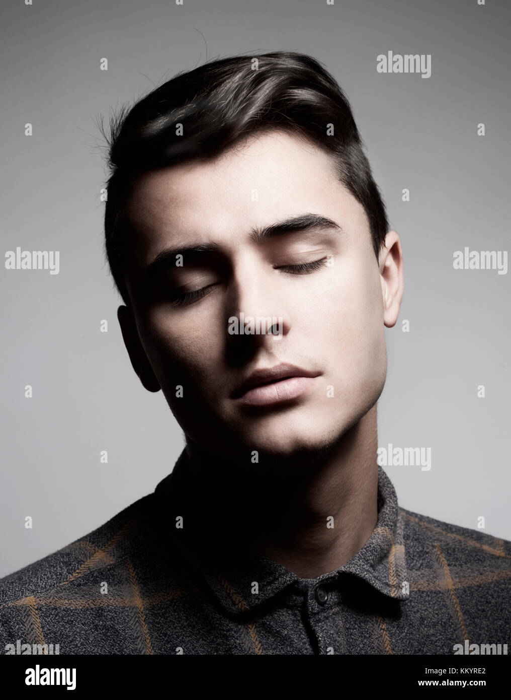 Studio Portrait of a Teenage Boy with Closed Eyes Stock Photo - Alamy