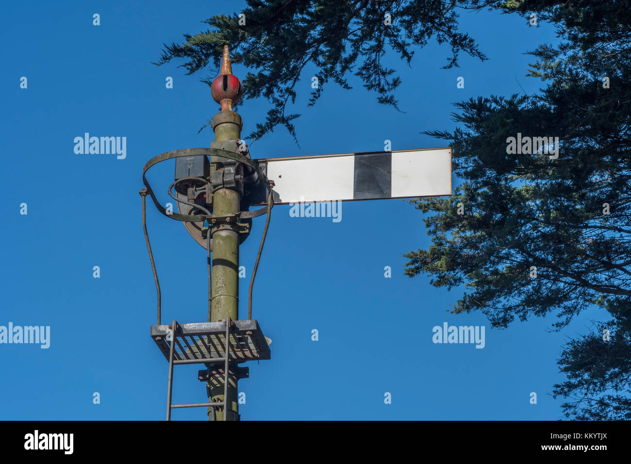 Old-style railway Semaphore signal in Cornwall, set against a bright ...