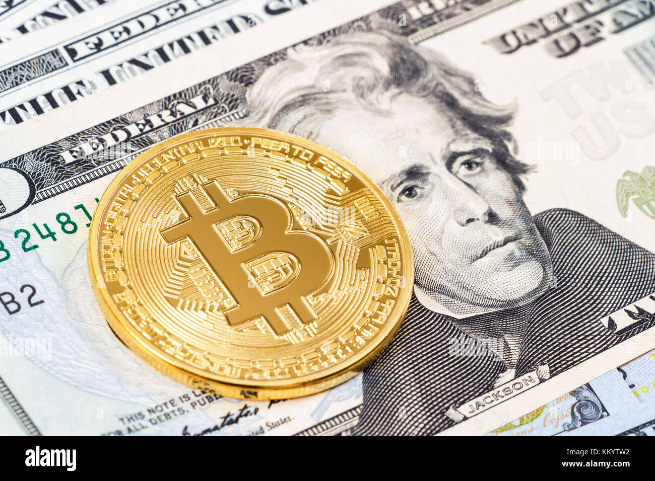 Cryptocurrency of the Bitcoin lying on the american dollar banknote ...