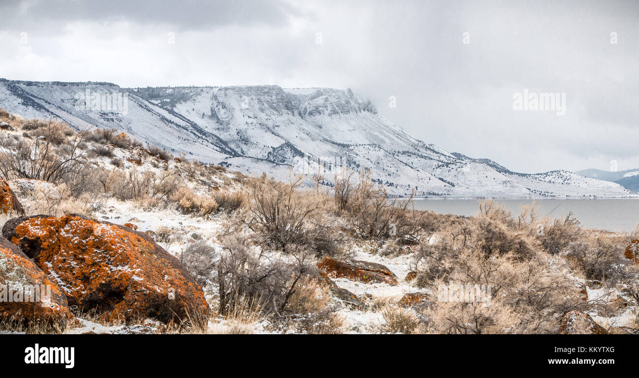 Snow covering the rocky shore of Lake Albert and the Albert Rim ...