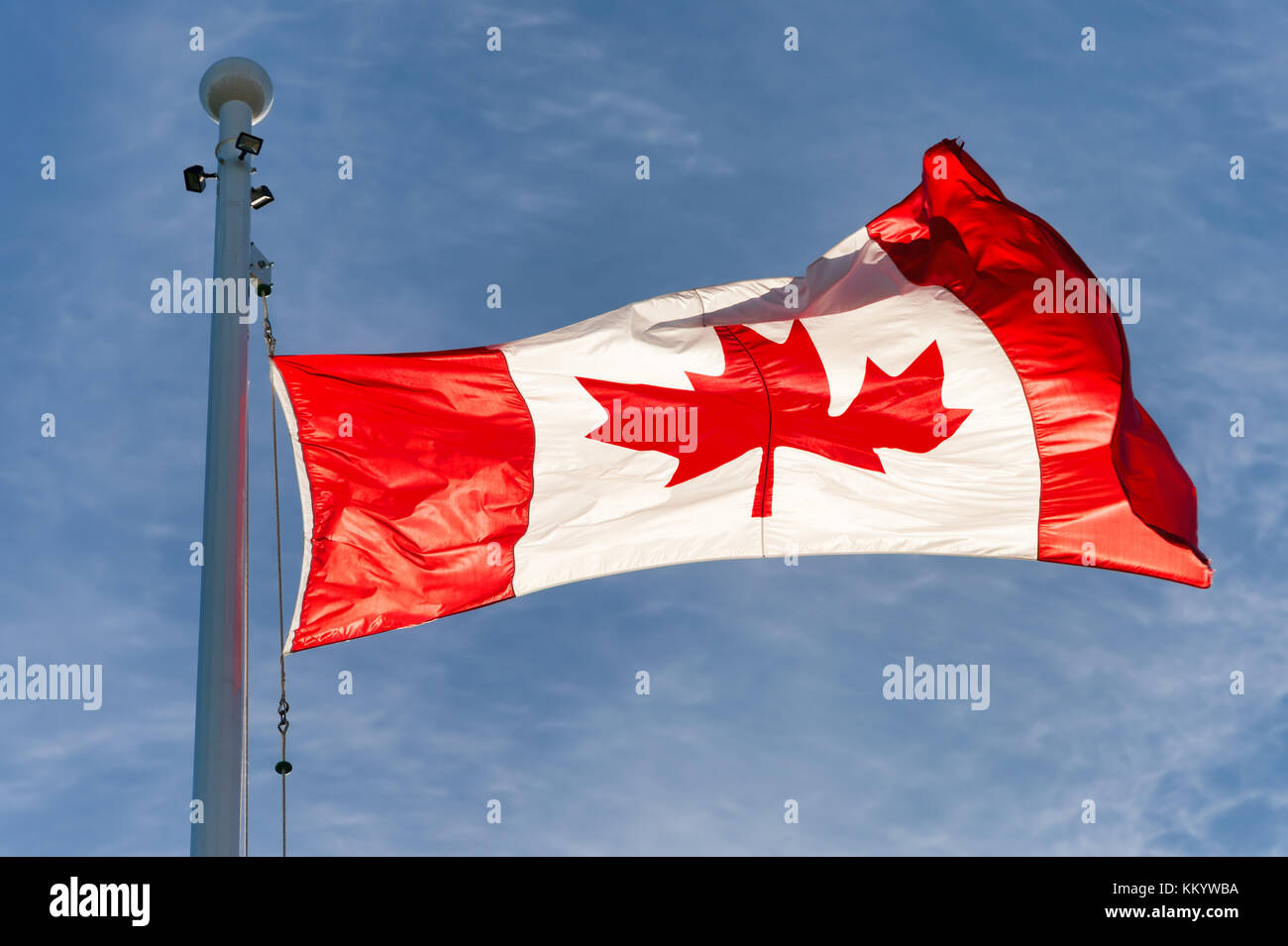 Flag of Canada flying against a blue sky in Vancouver, BC, Canada Stock ...