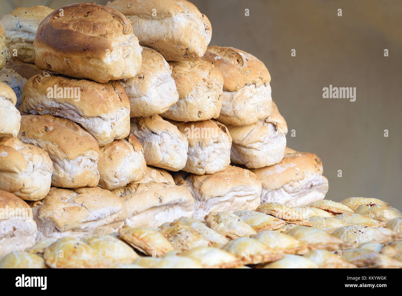 Some bread in a bakery against a dark background. Empty copy space for ...