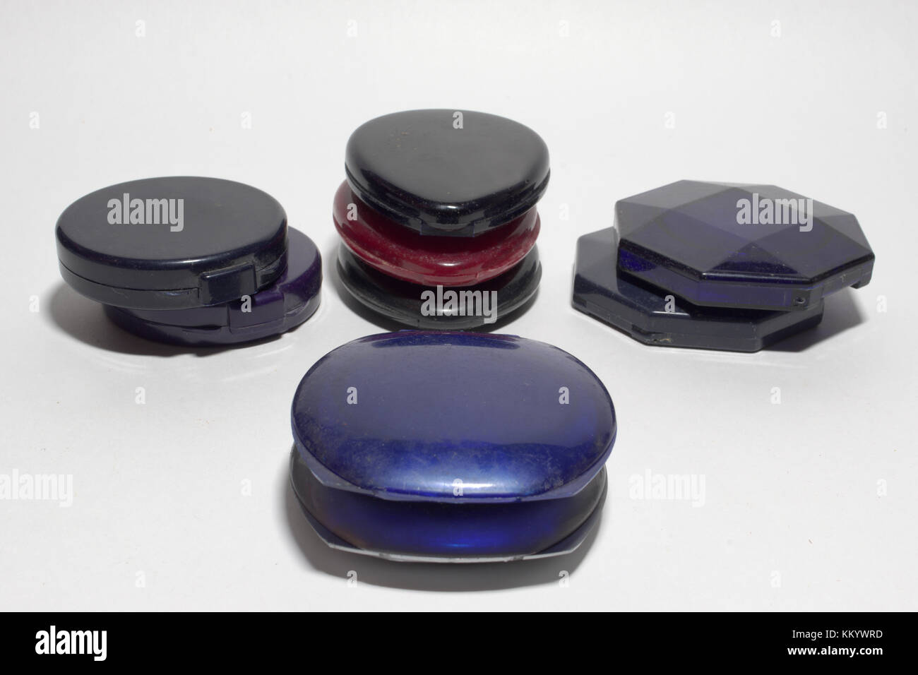 Set of powder case different forms and colors. Closeup Stock Photo - Alamy