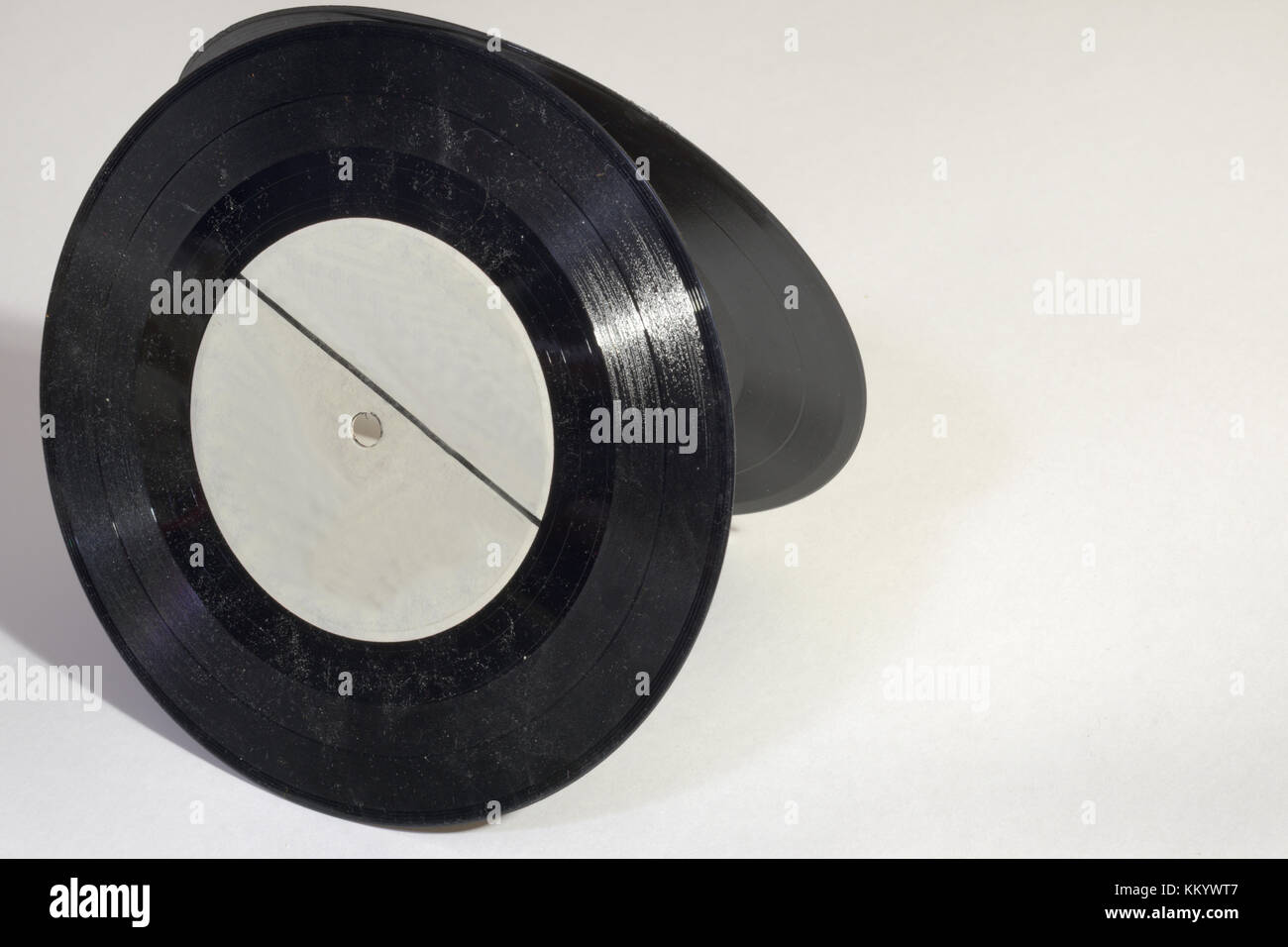 vinyl records, standing on its facets, backing each other Stock Photo ...