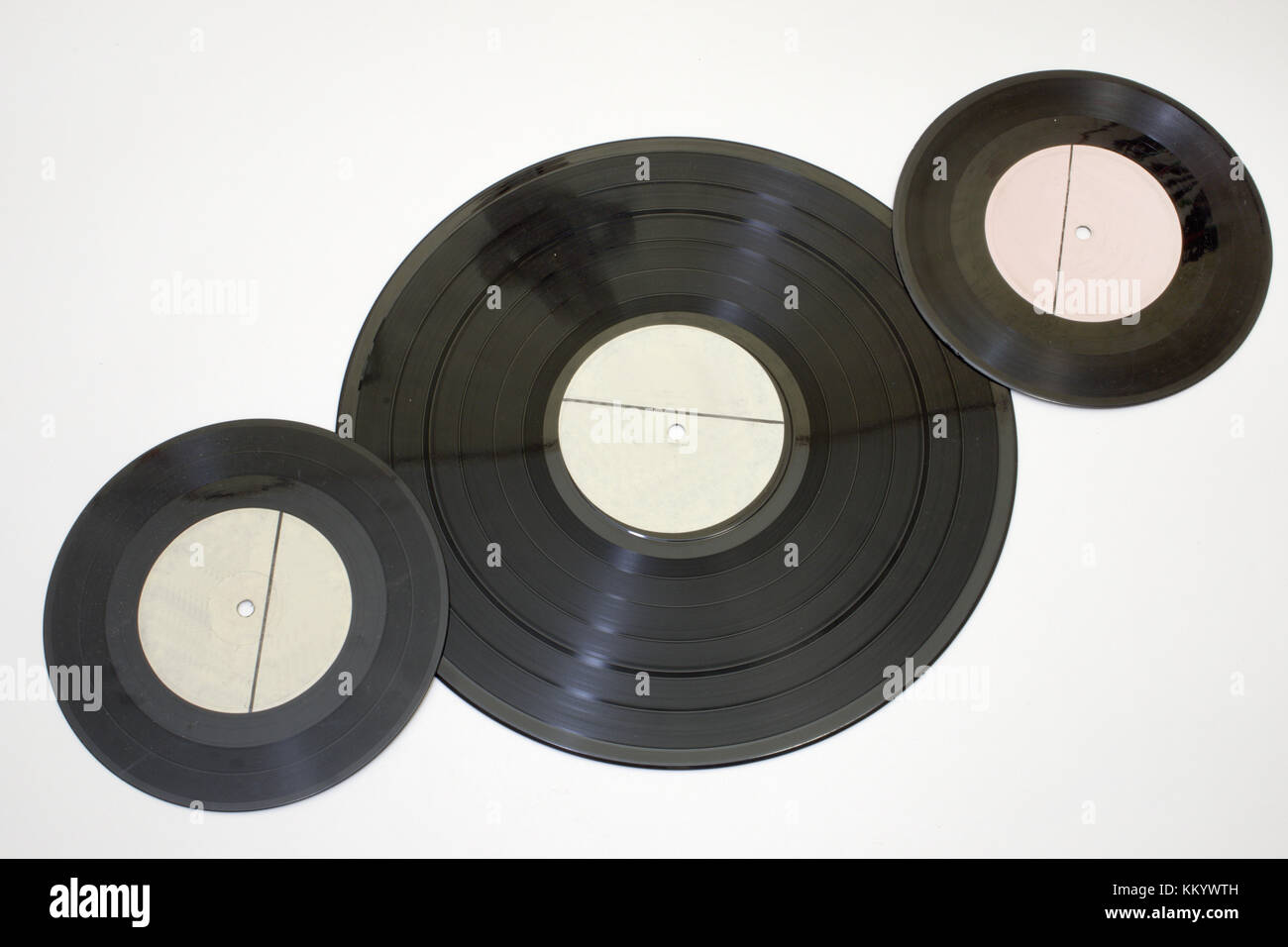 Vinyl records of different disc diameters. lay from corner to corner ...