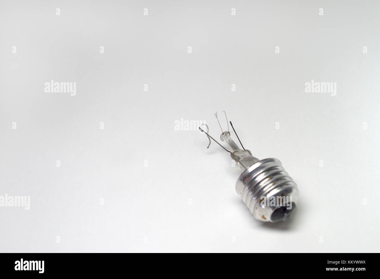 base of broken incandescent bulb. torn tungsten thread Stock Photo - Alamy