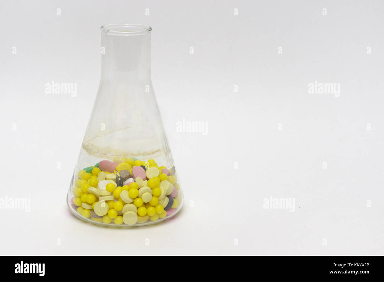 Erlenmeyer flasks, filled with tablets and dragee Stock Photo - Alamy