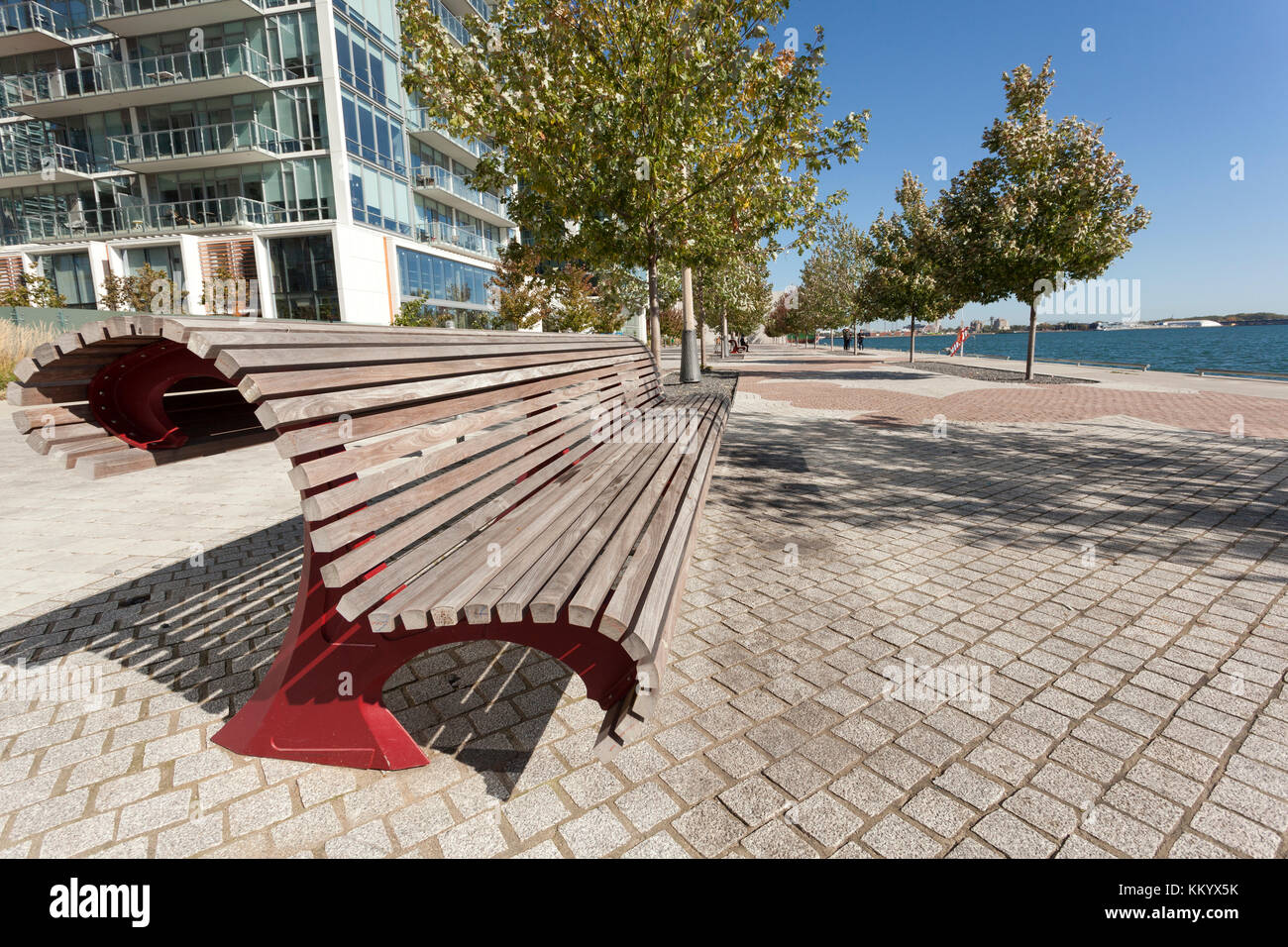Wooden bench at the waterfront promenade in Toronto, Canada Stock Photo ...