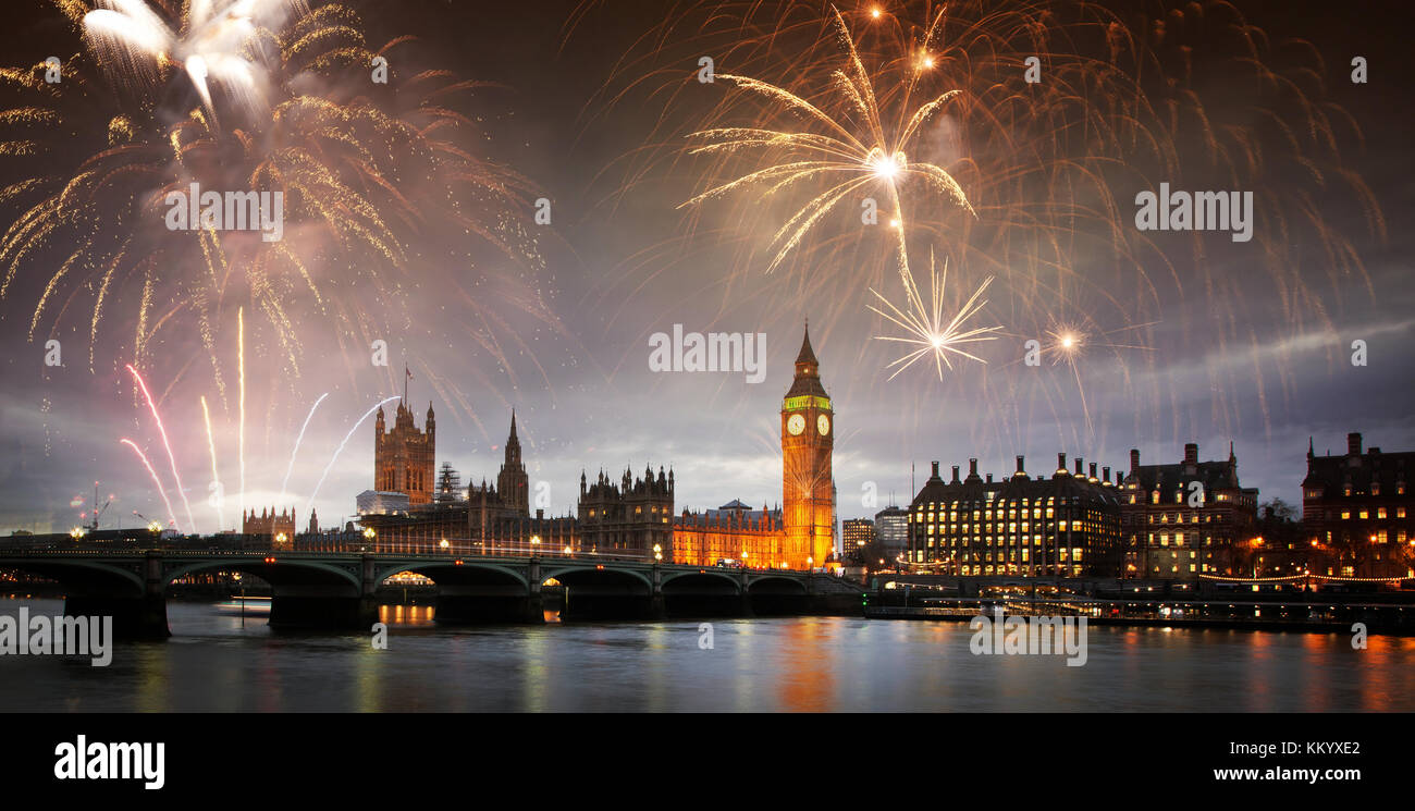 explosive fireworks display fills the sky around Big Ben. New Year's ...