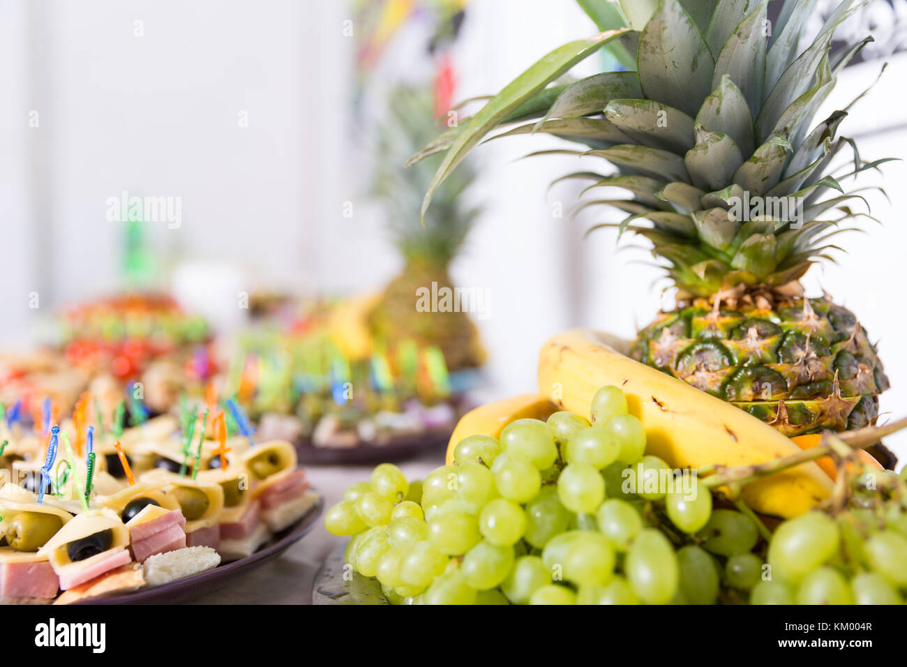 Fresh fruits plates on a table for party Stock Photo - Alamy
