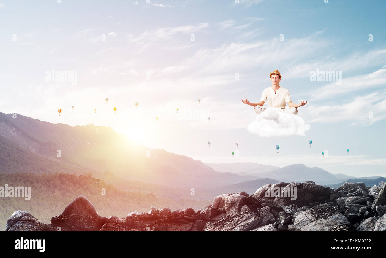 Young man keeping mind conscious Stock Photo - Alamy