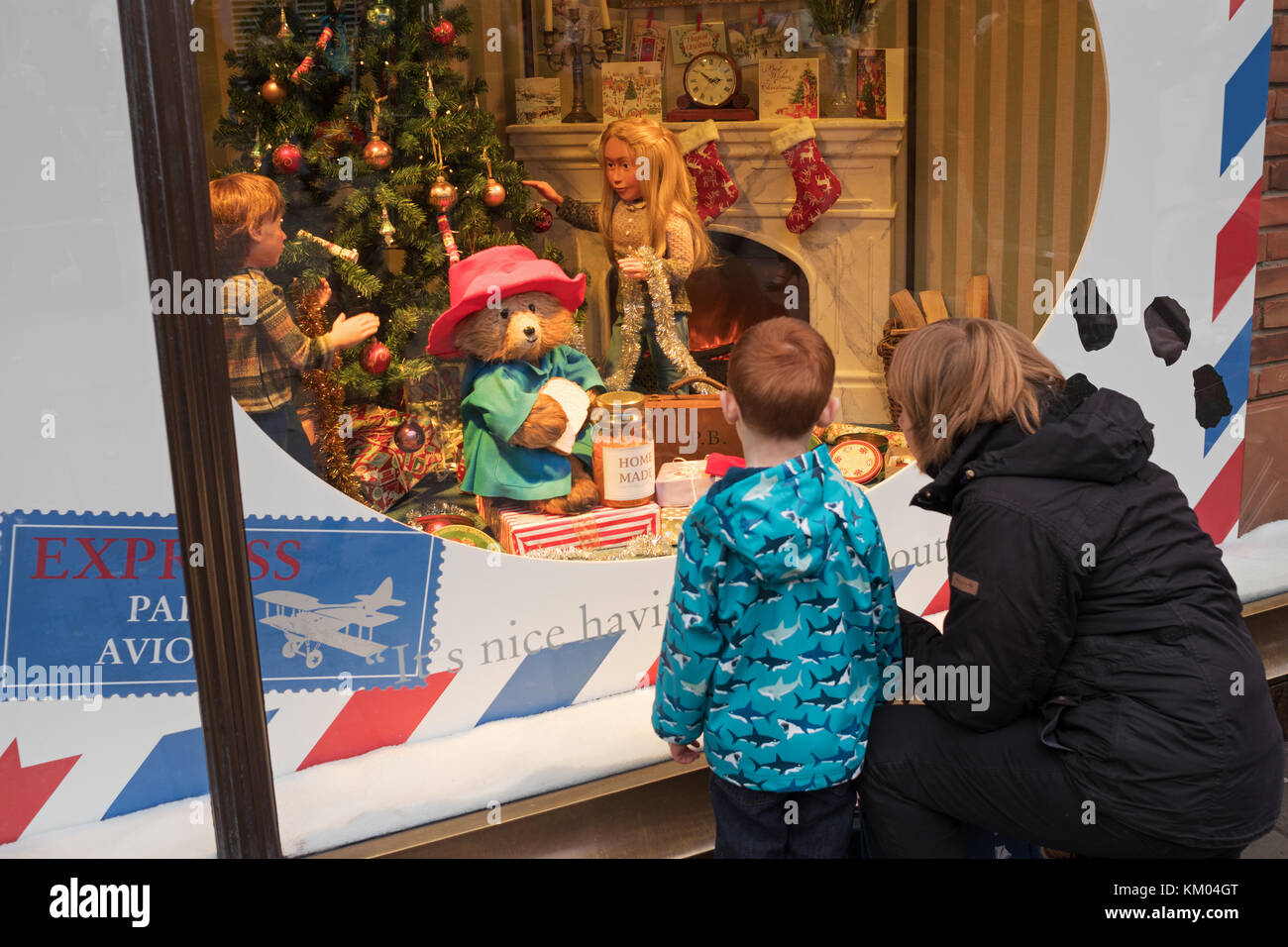 People looking at Fenwick's 2017 Paddington Bear Christmas display ...