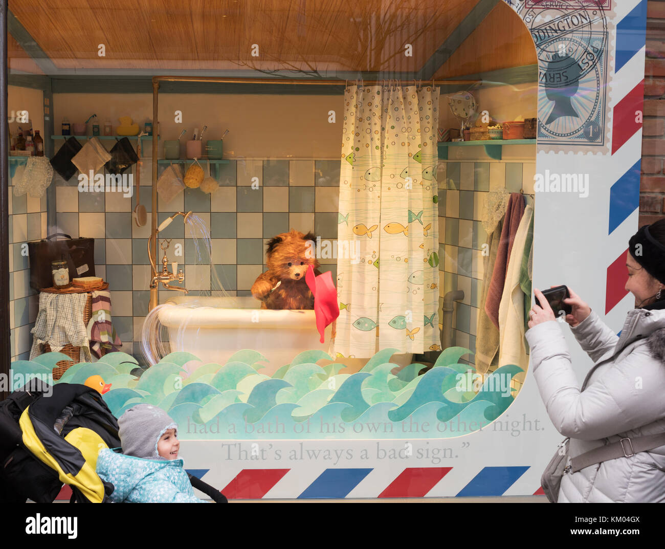 People looking at Fenwick's 2017 Paddington Bear Christmas display ...