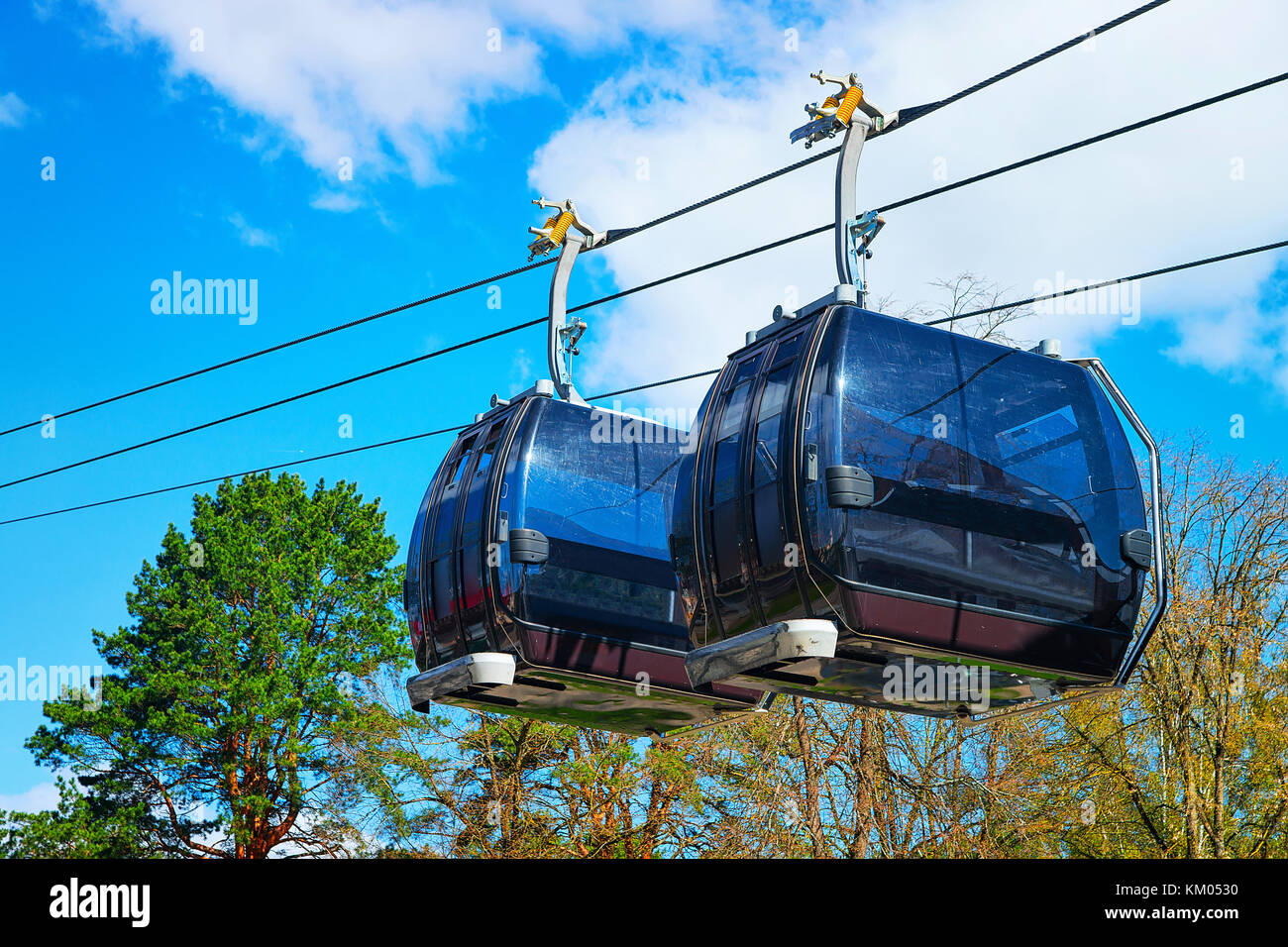 Cable cars moving at the ropeway Stock Photo - Alamy