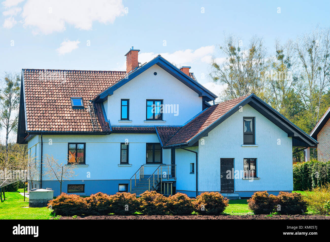 Modern cottage country house with small court yard Stock Photo - Alamy