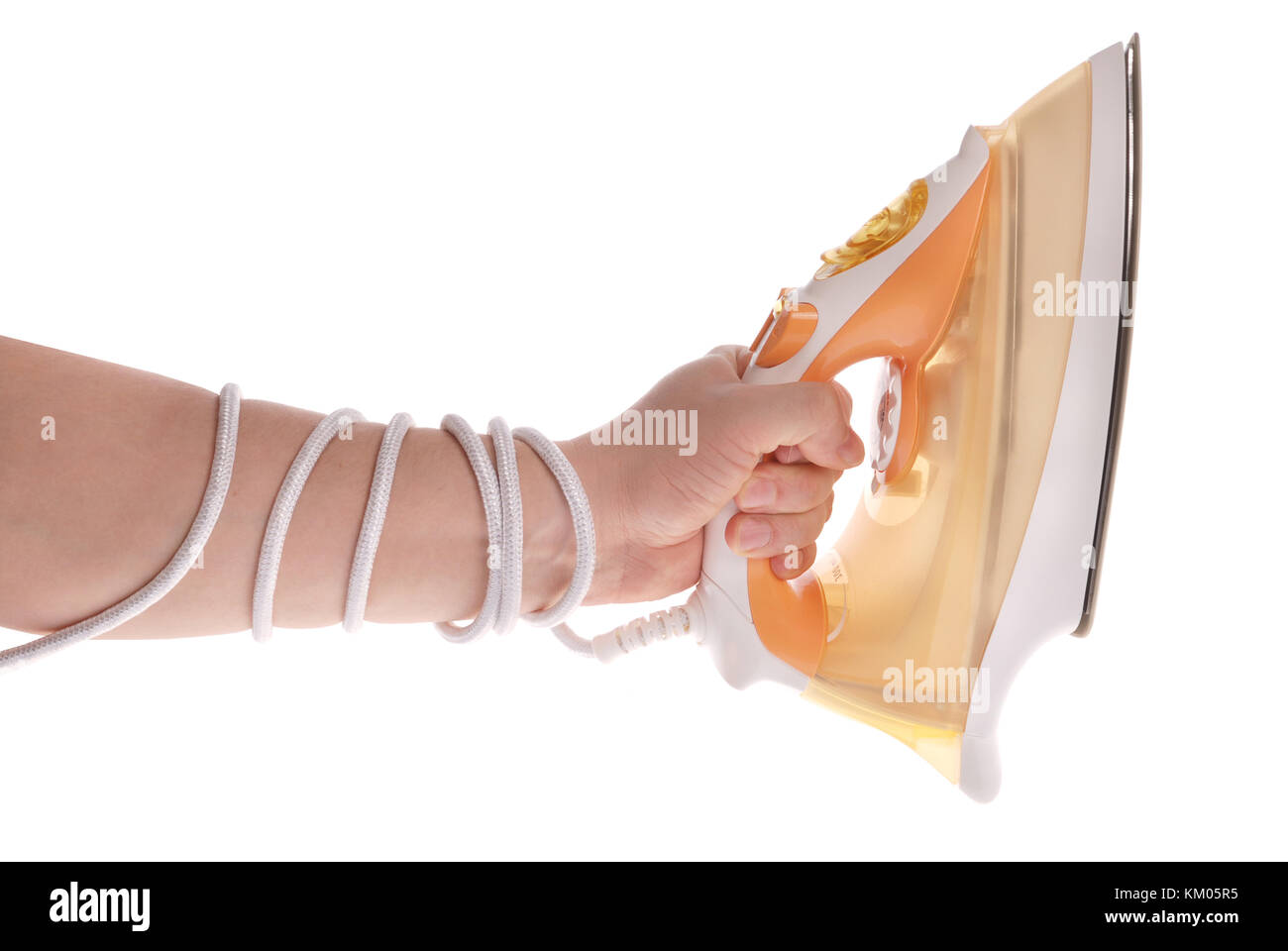 Electric iron in a hand isolated on white Stock Photo - Alamy