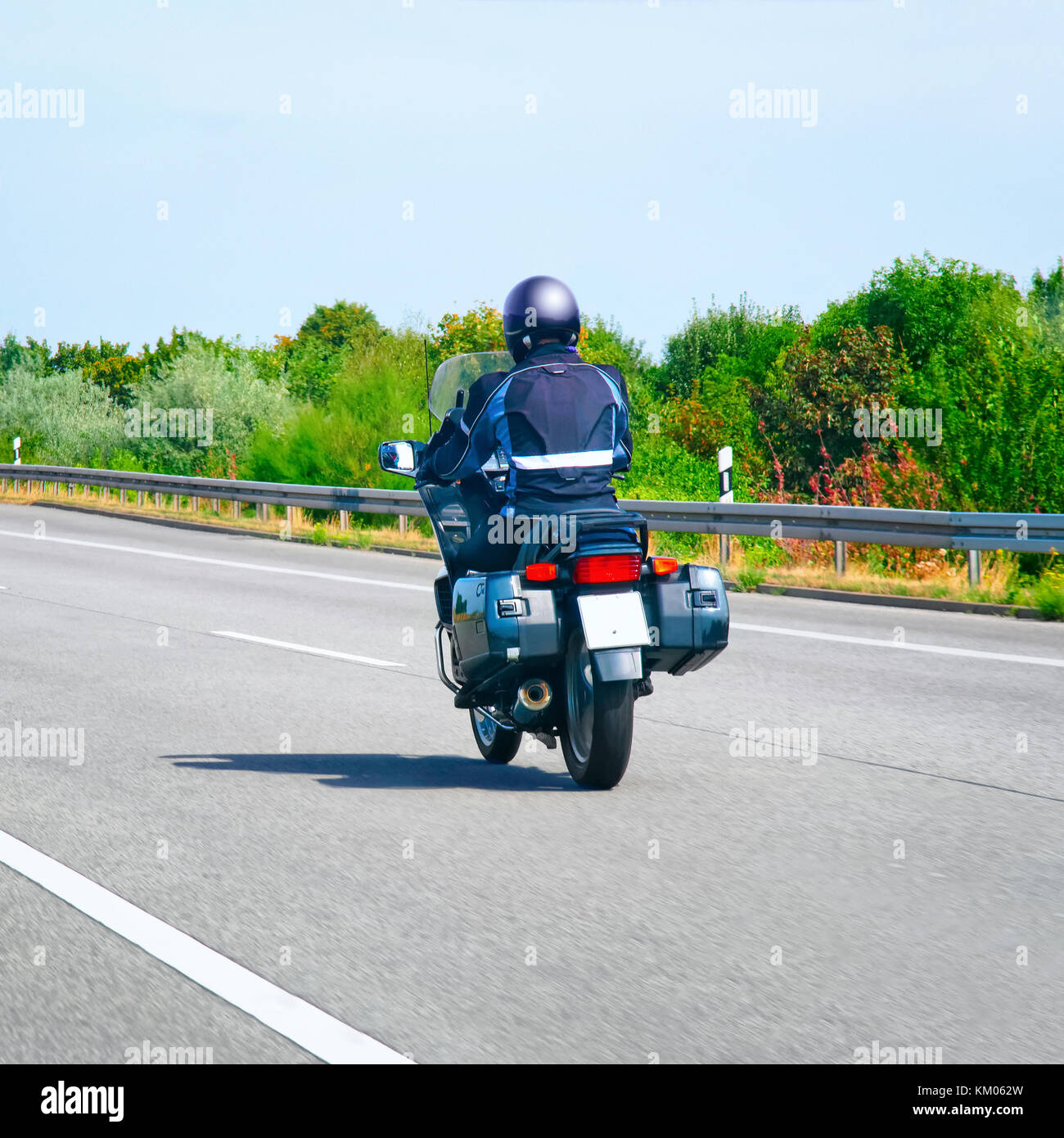 Motorbiker in the road in Switzerland Stock Photo - Alamy