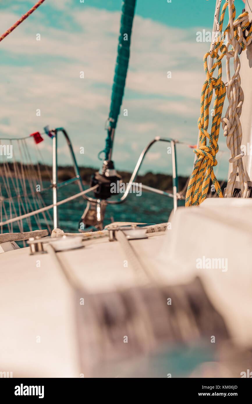 Lapper genoa roller jib, jibsheet on boat during cruise on sea water ...