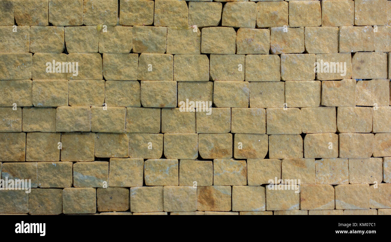 Decorative stone background built of little stones Stock Photo - Alamy