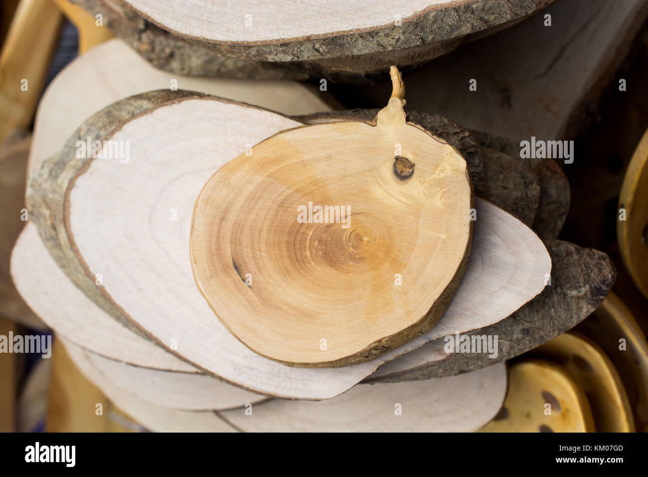 Wood Log cut in round thin pieces in view Stock Photo - Alamy