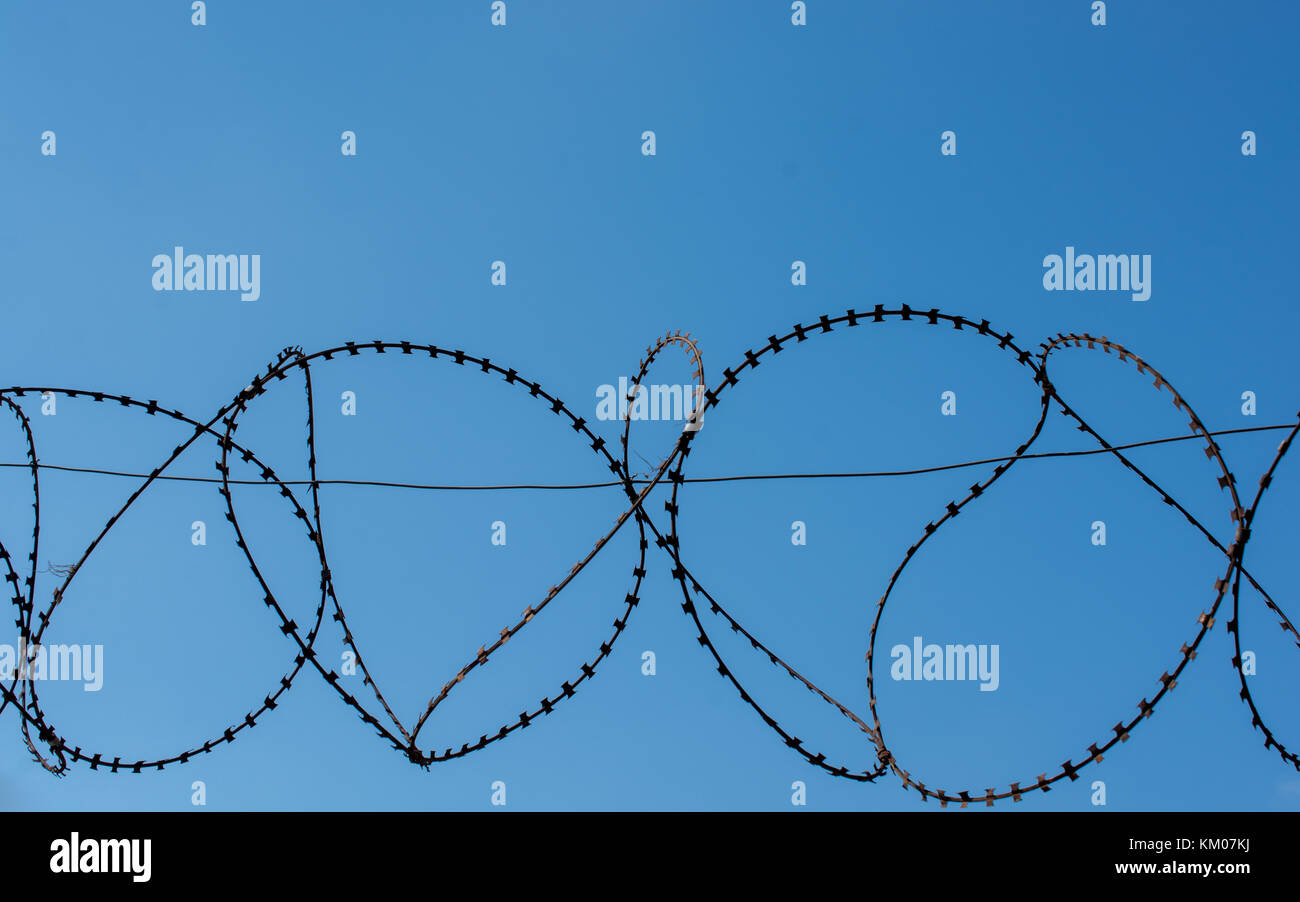 barbed wire fence used for protection purposes Stock Photo - Alamy