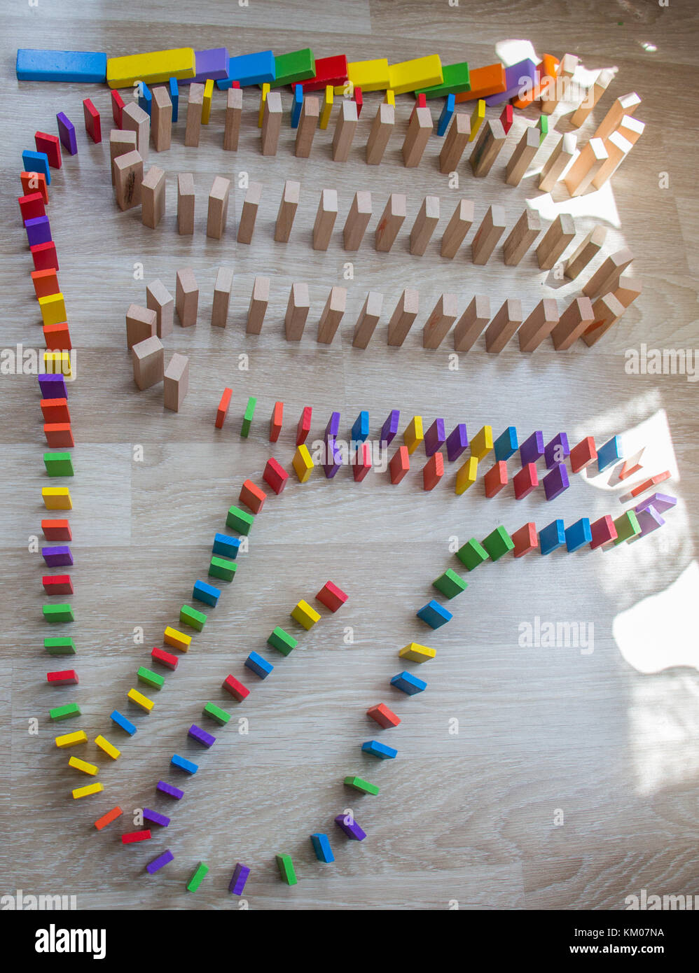 Colorful Domino Blocks in a line on a white background Stock Photo - Alamy