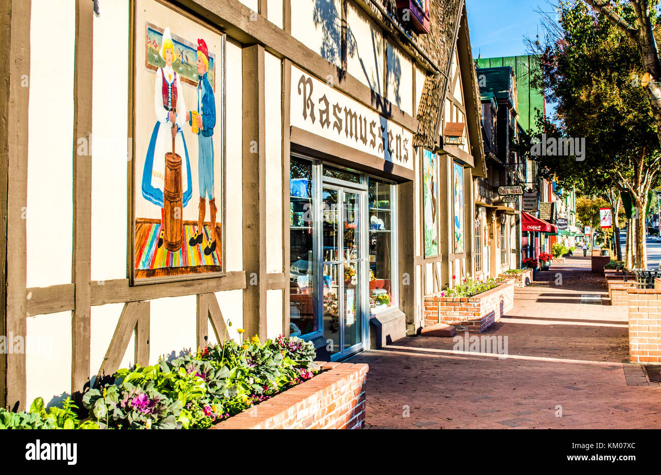 quaint shops in Danish style buildings with early morning sunlight in ...
